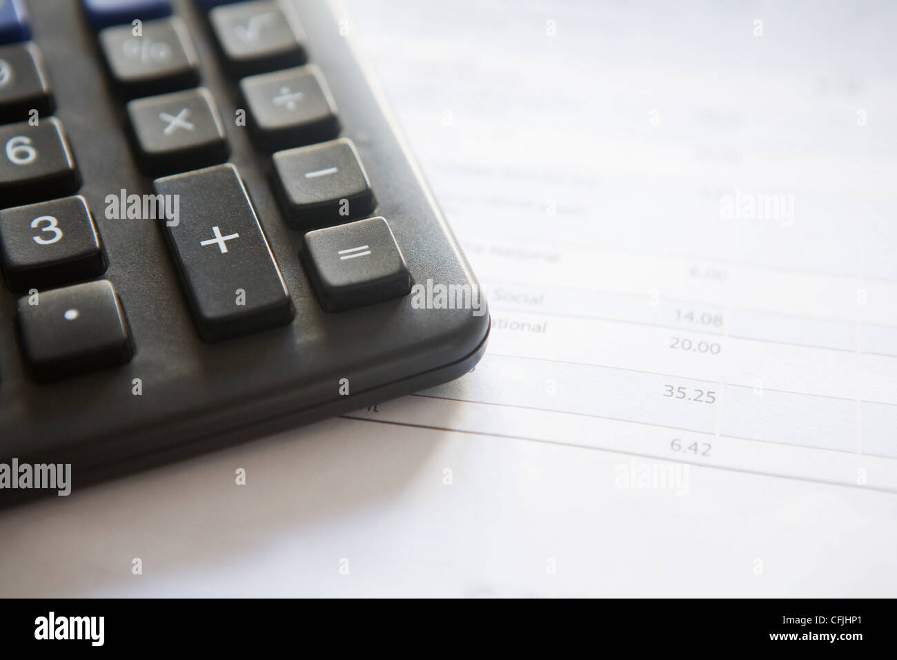 Calculator and bill Stock Photo - Alamy