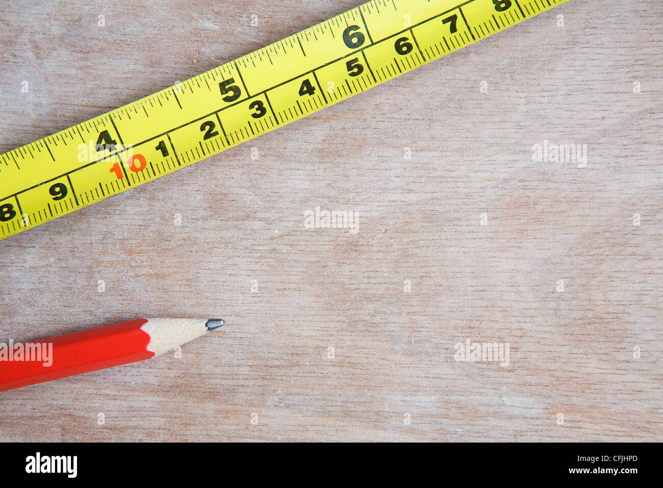 Measuring tape and pencil Stock Photo - Alamy