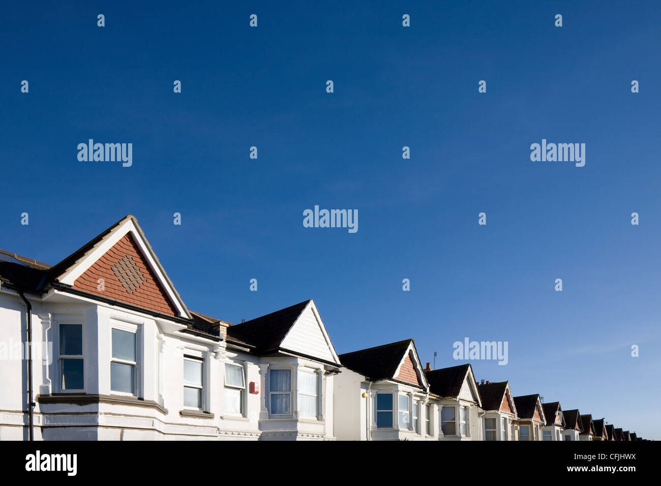 Houses and blue sky Stock Photo - Alamy