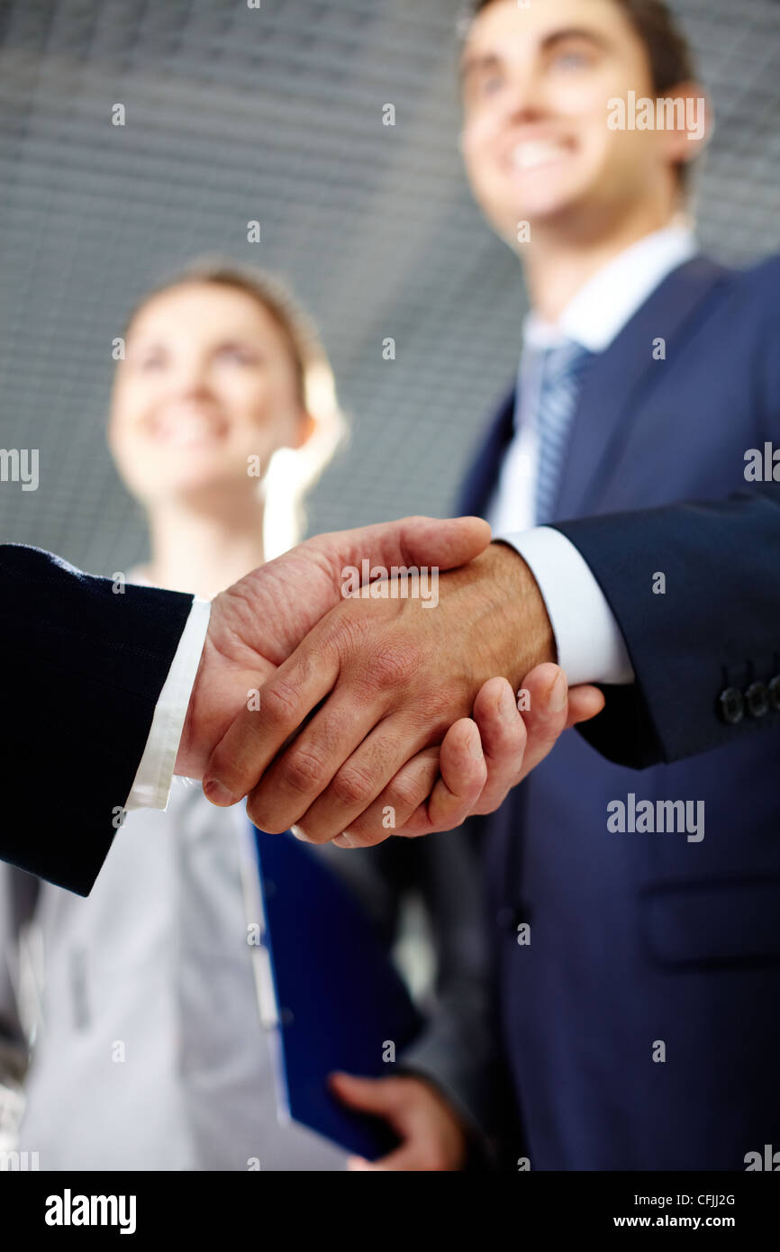 Close-up of two men hands shaking after signing contract Stock Photo ...