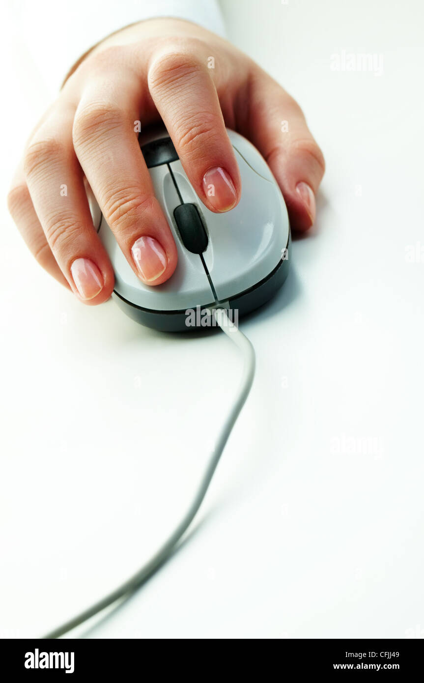 Close-up of female hand on white mouse Stock Photo - Alamy