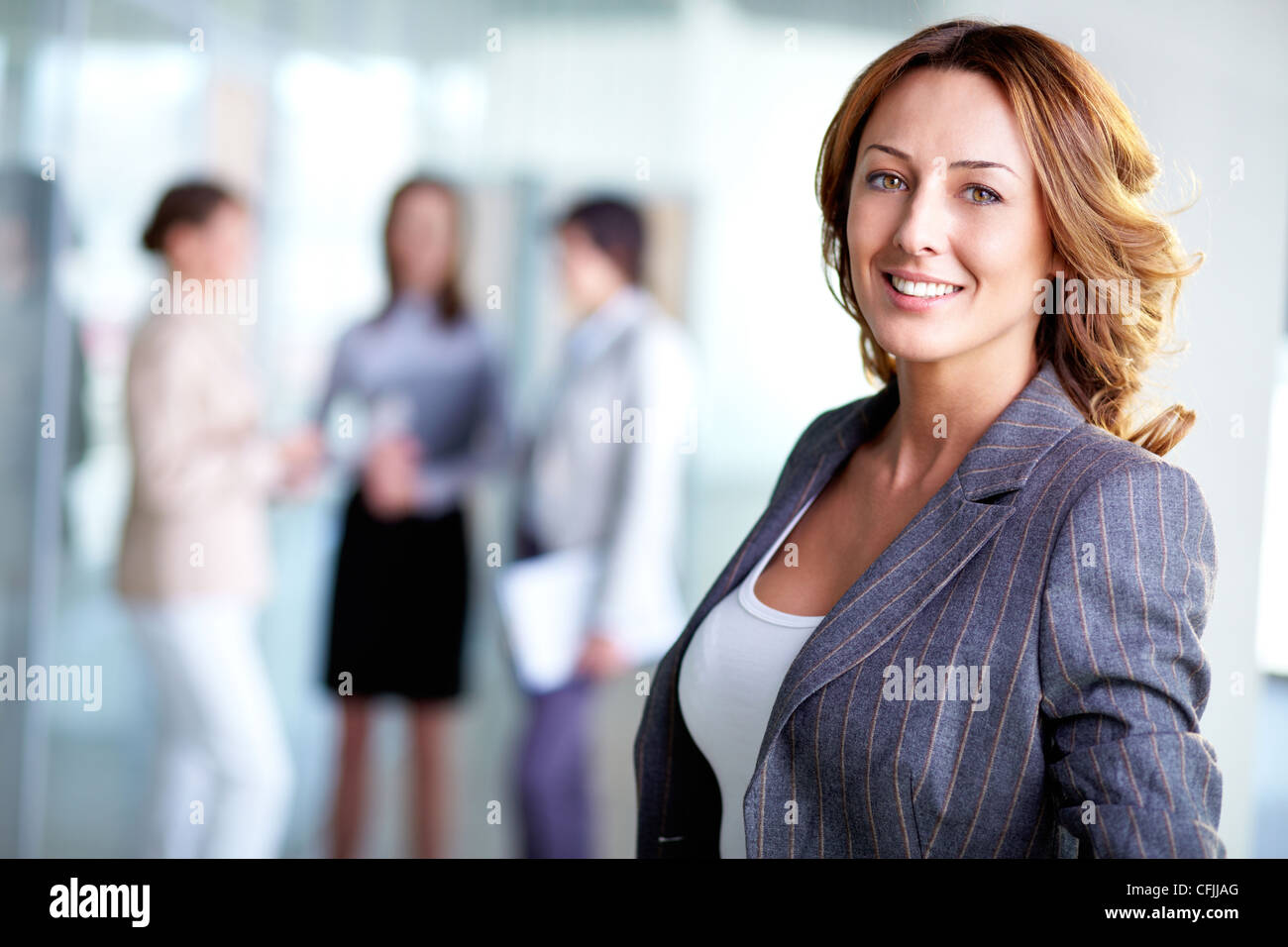 Image of pretty business leader looking at camera Stock Photo - Alamy
