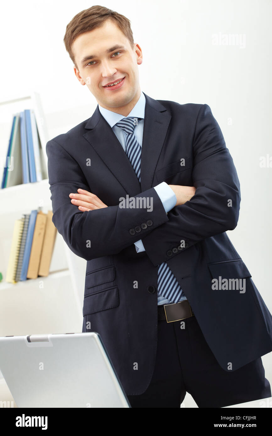 Portrait of happy man at workplace looking at camera Stock Photo - Alamy