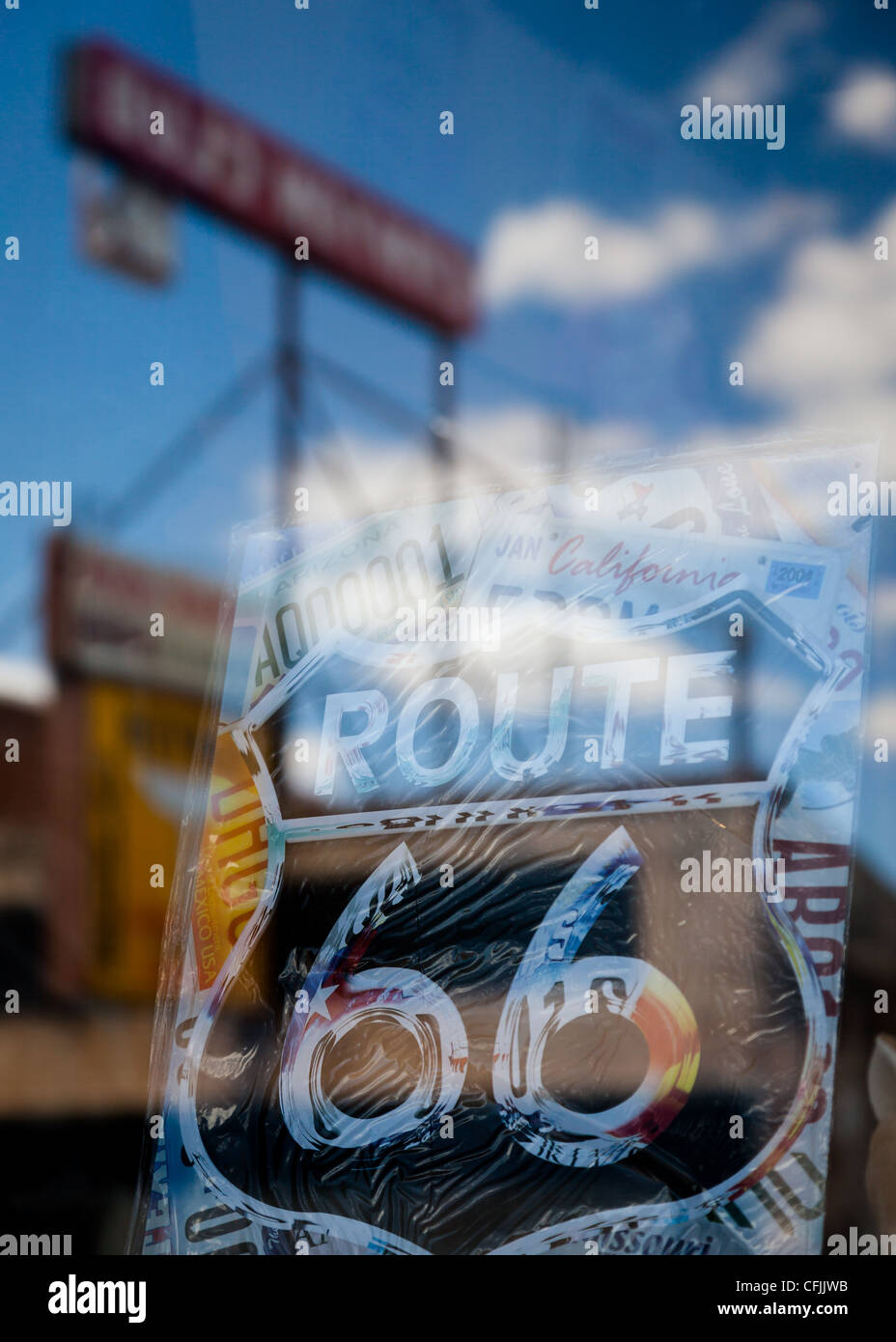 Route 66 sign and street reflection in a shop window on a sunny day in ...