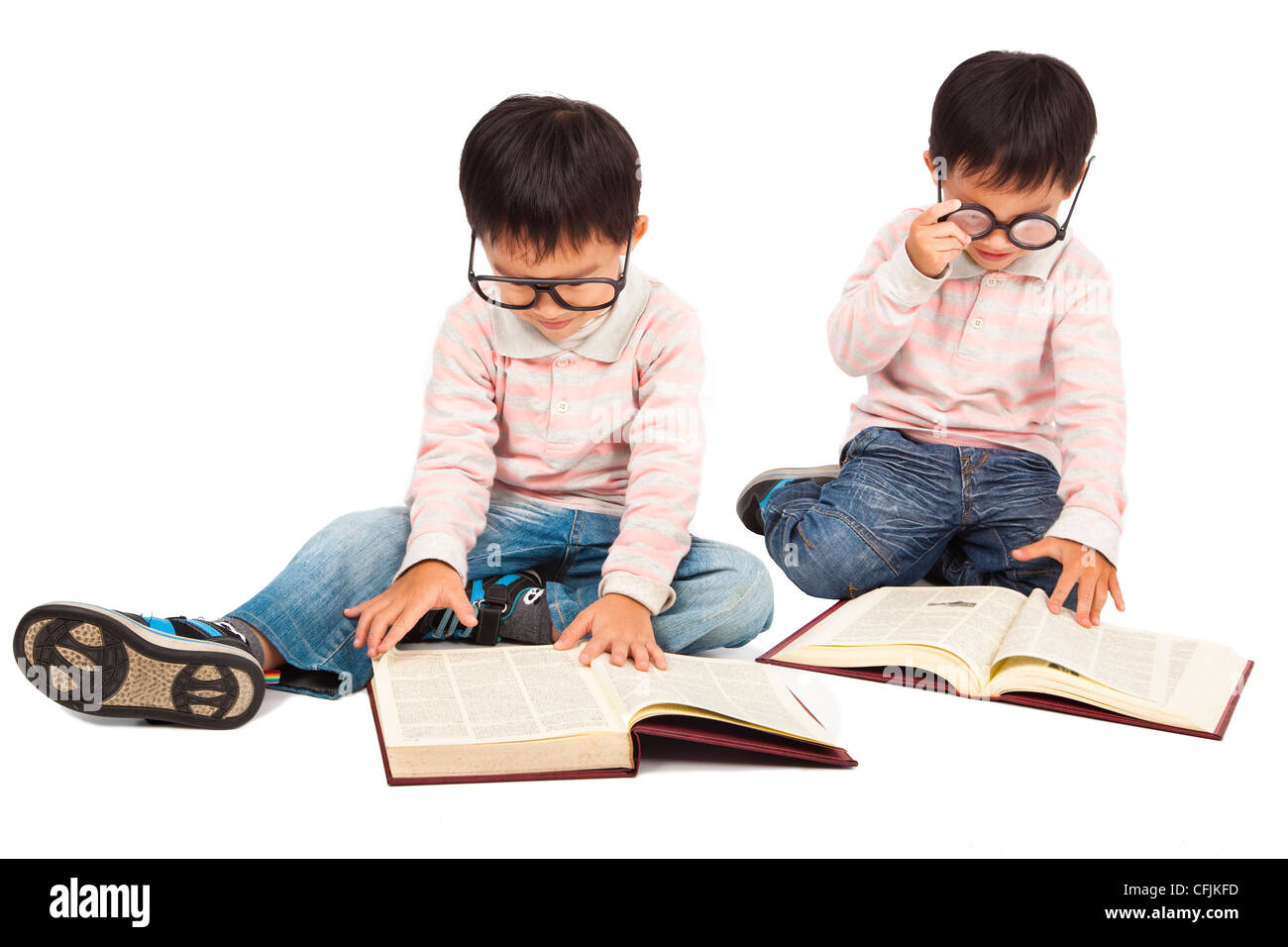 children reading book on the floor and isolated on white Stock Photo ...