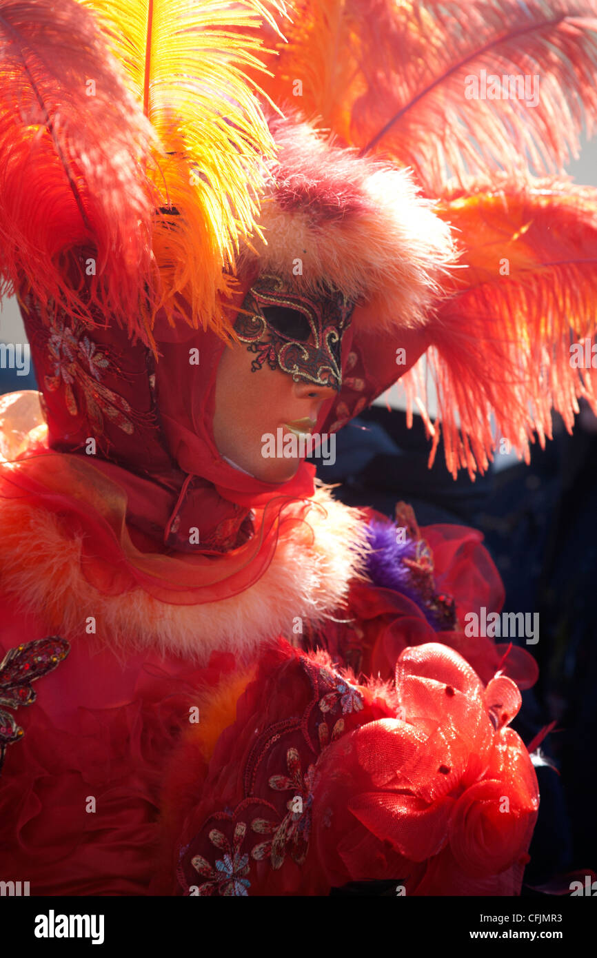 Person dressed up in orange and red carnival costume for the Carnival ...