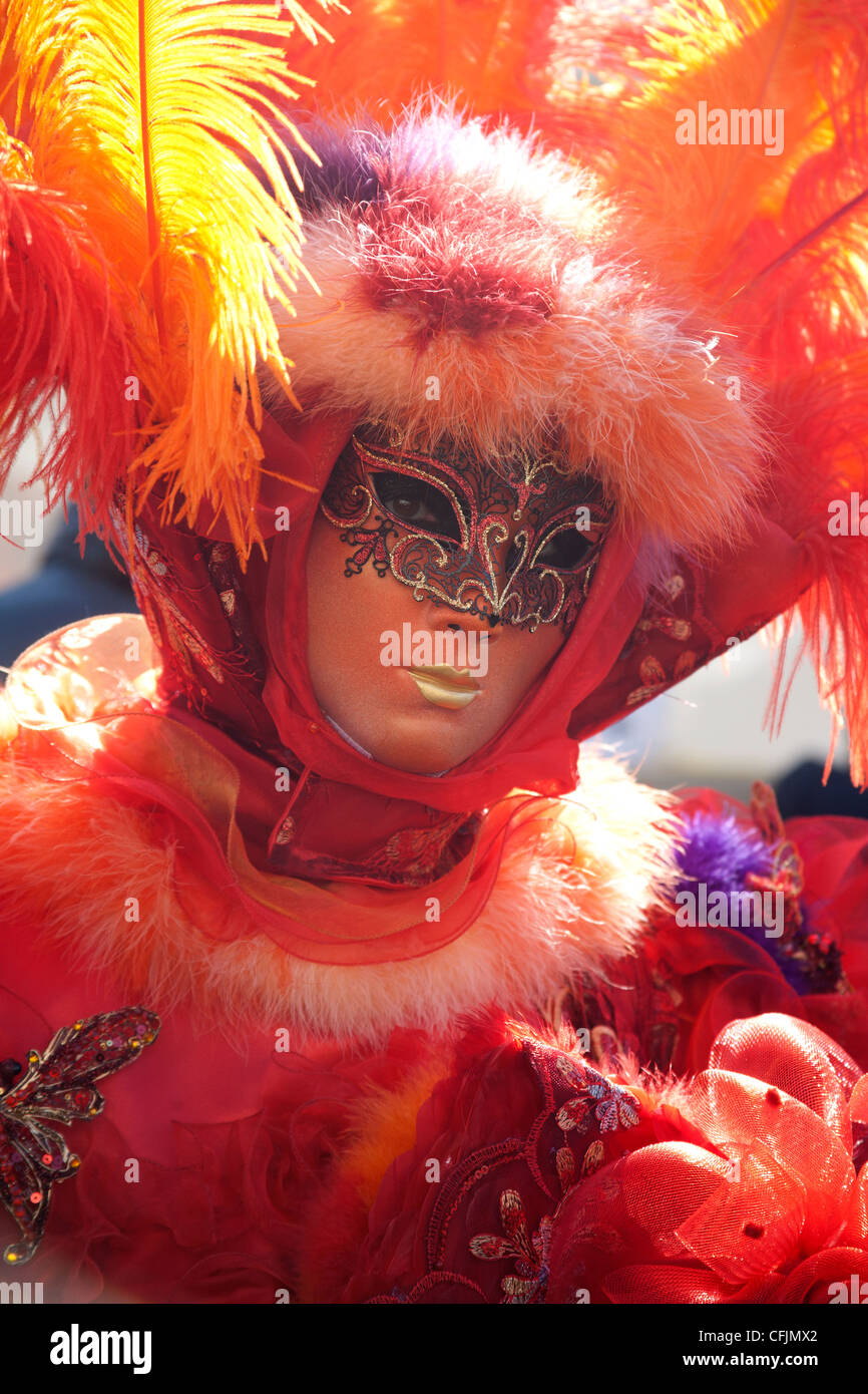 Person dressed up in orange and red carnival costume for the Carnival ...