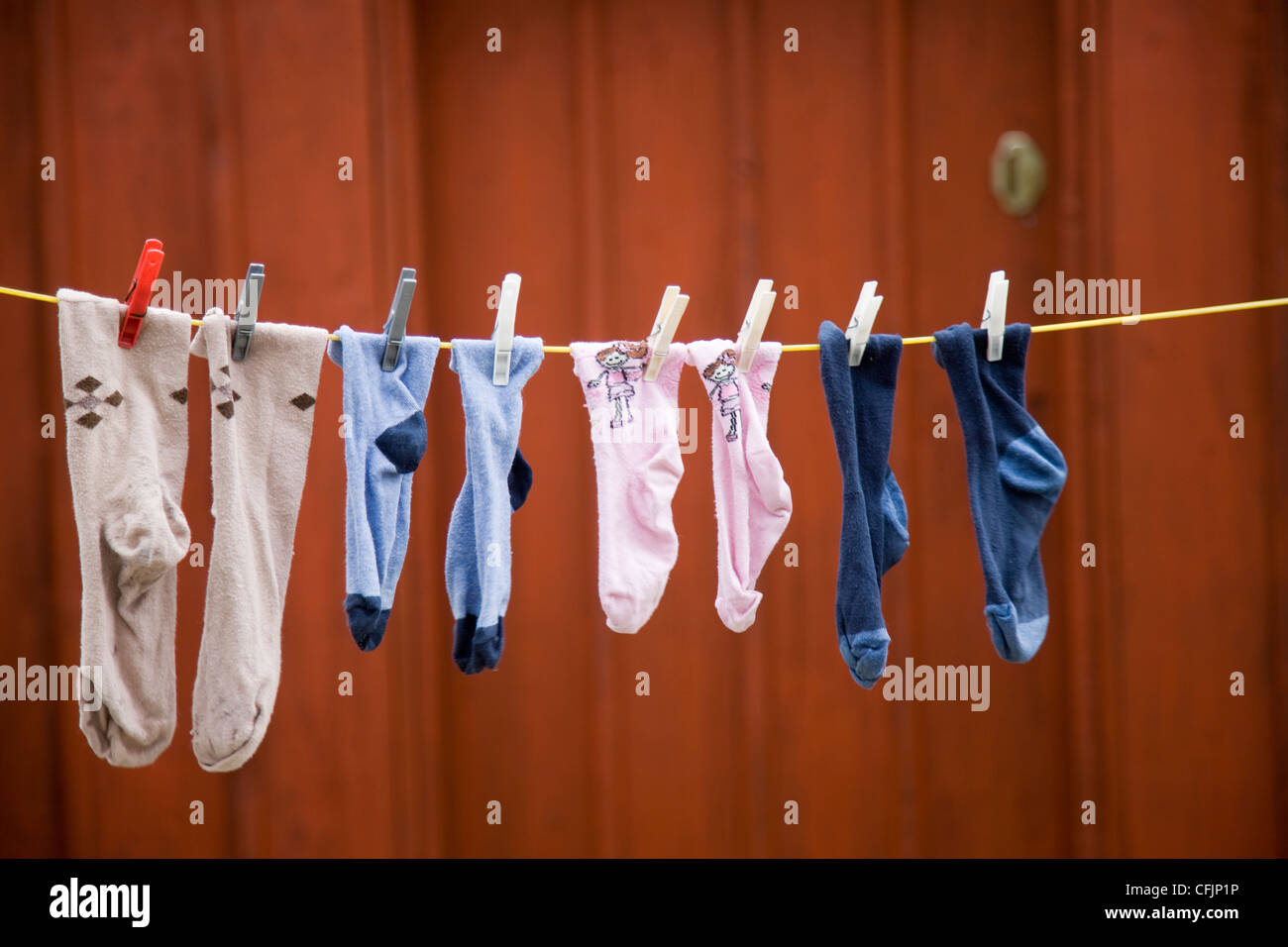 Pairs of socks pegged to the washing line Stock Photo - Alamy