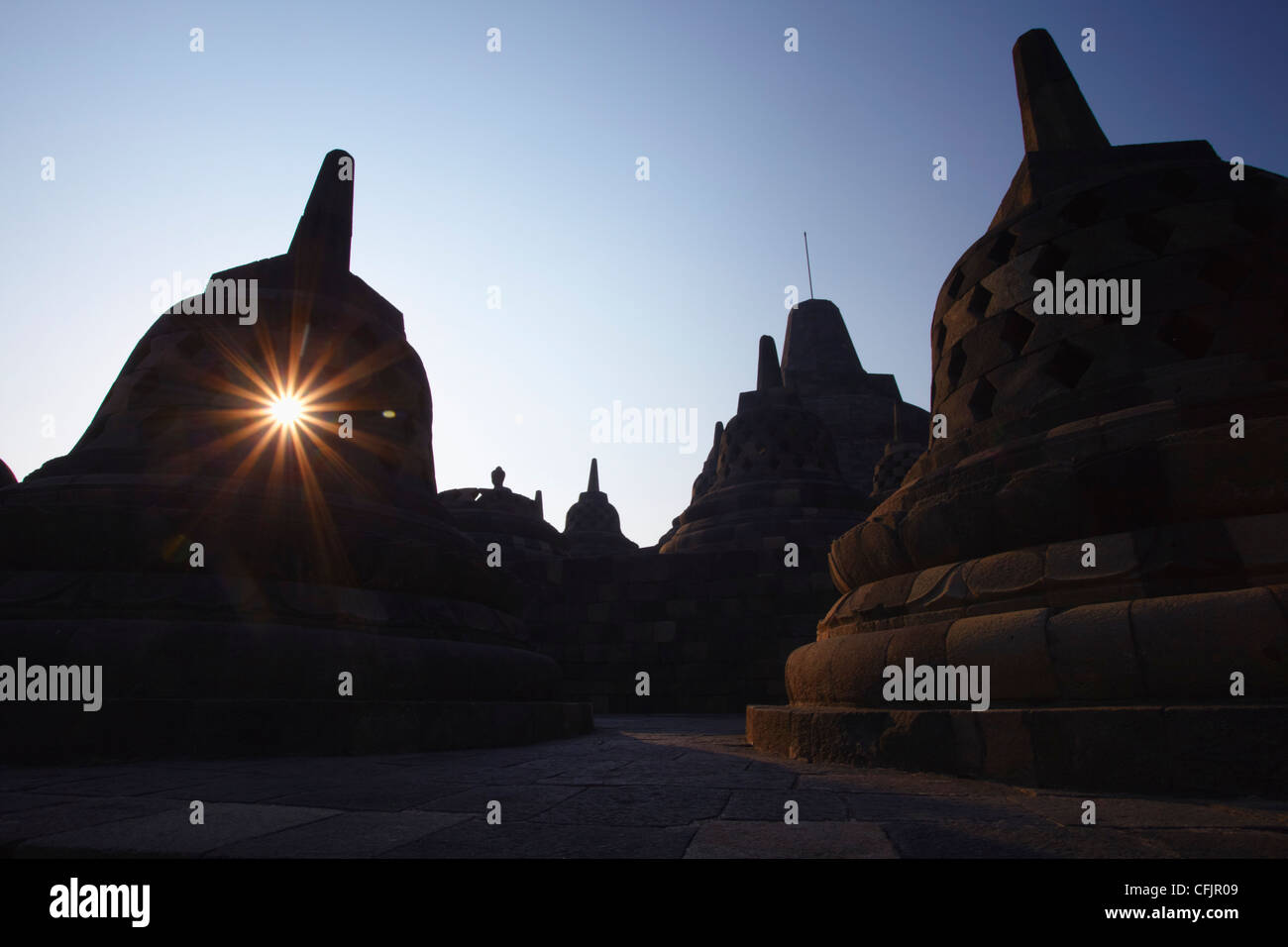 Stupas at Borobudur Temple at sunrise, UNESCO World Heritage Site, Java ...
