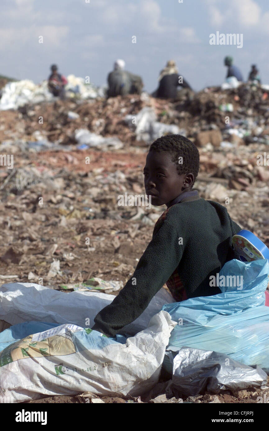 Squatter community living in squalor near a municipal dumping site in ...