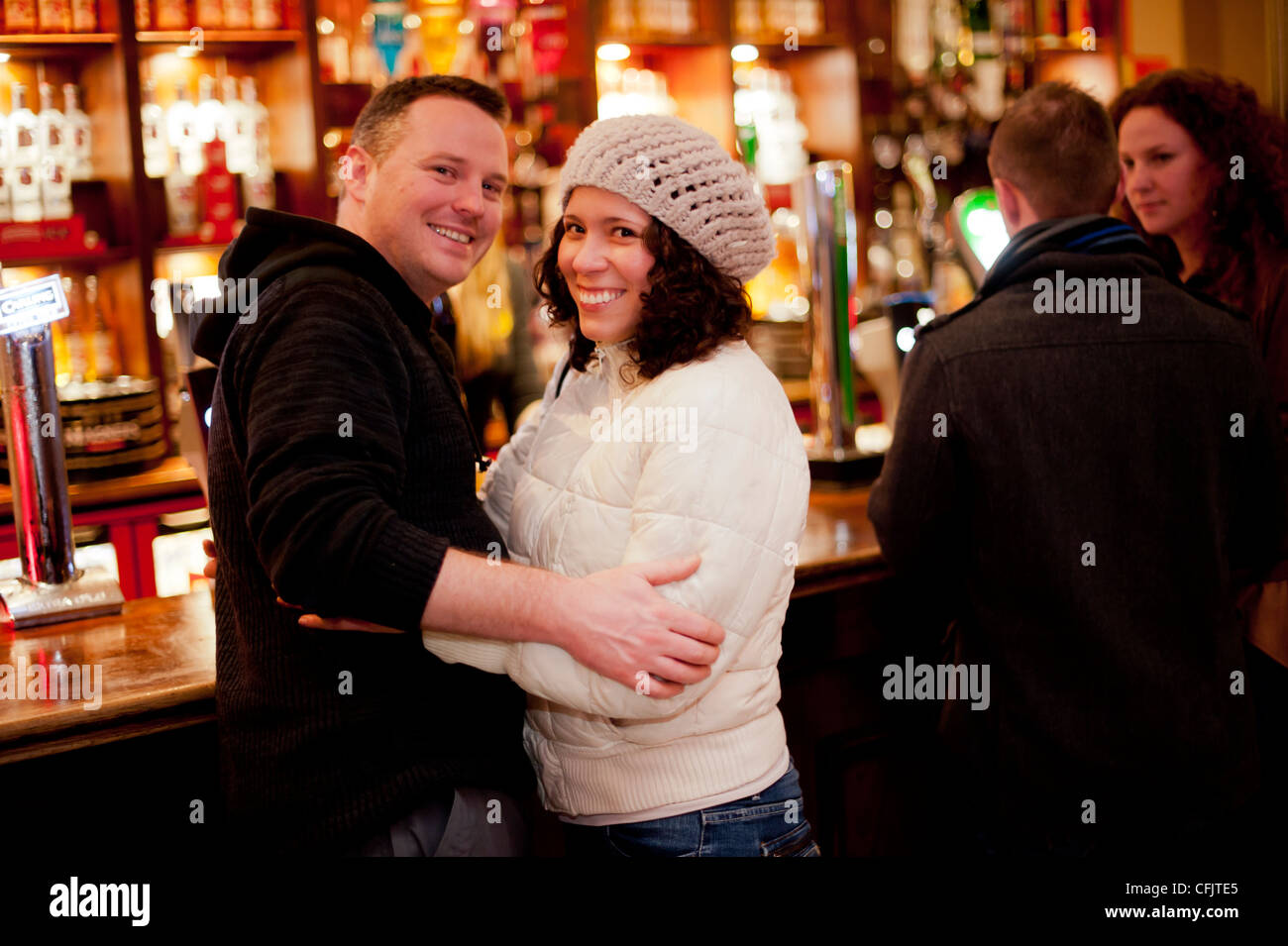 a young couple in a pub bar on a saturday night, aberystwyth wales uk ...