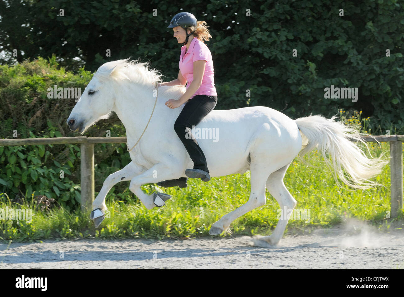 Woman riding grey horse bareback hi-res stock photography and images ...