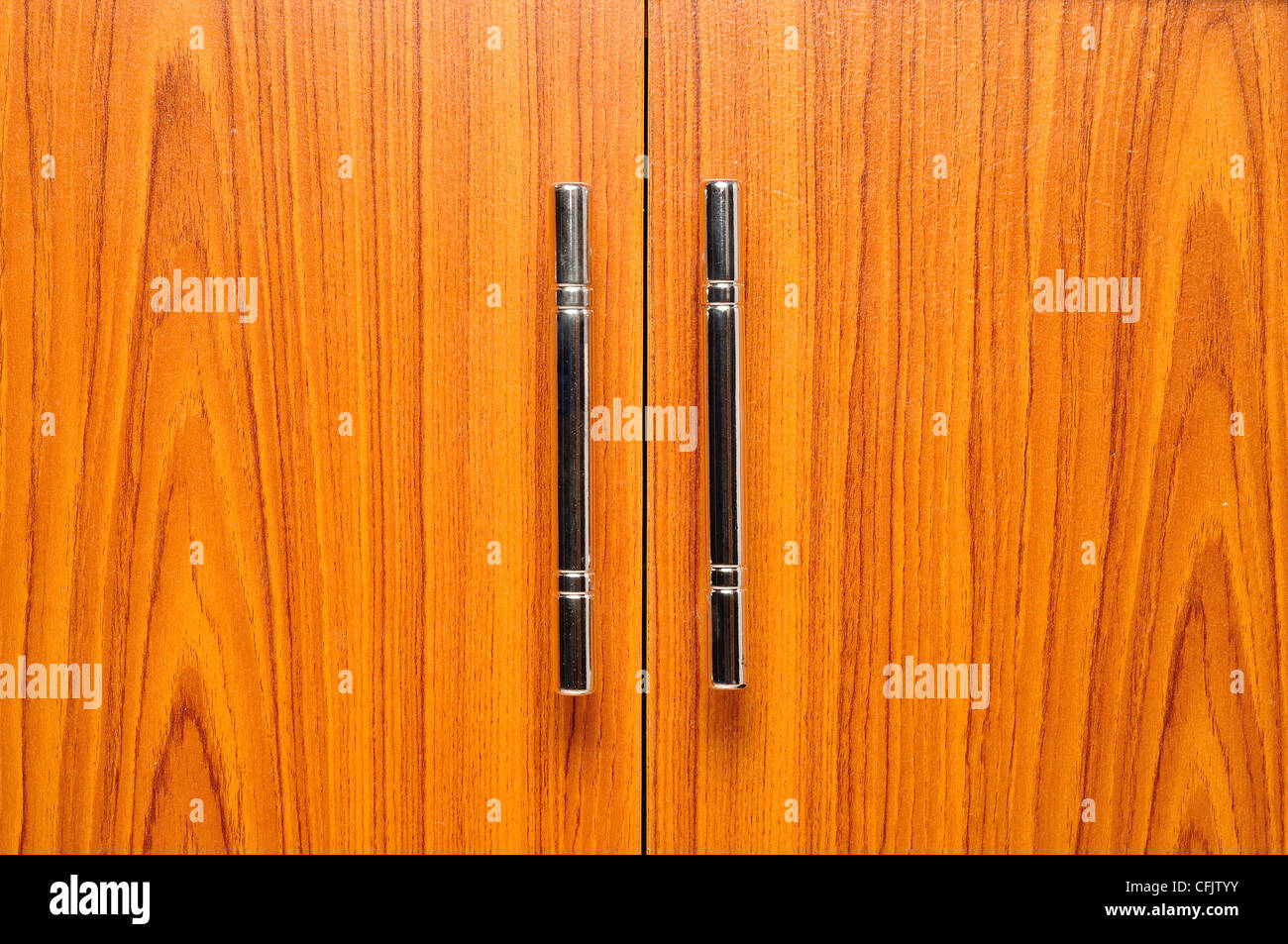 light brown doors with metal handles Stock Photo - Alamy