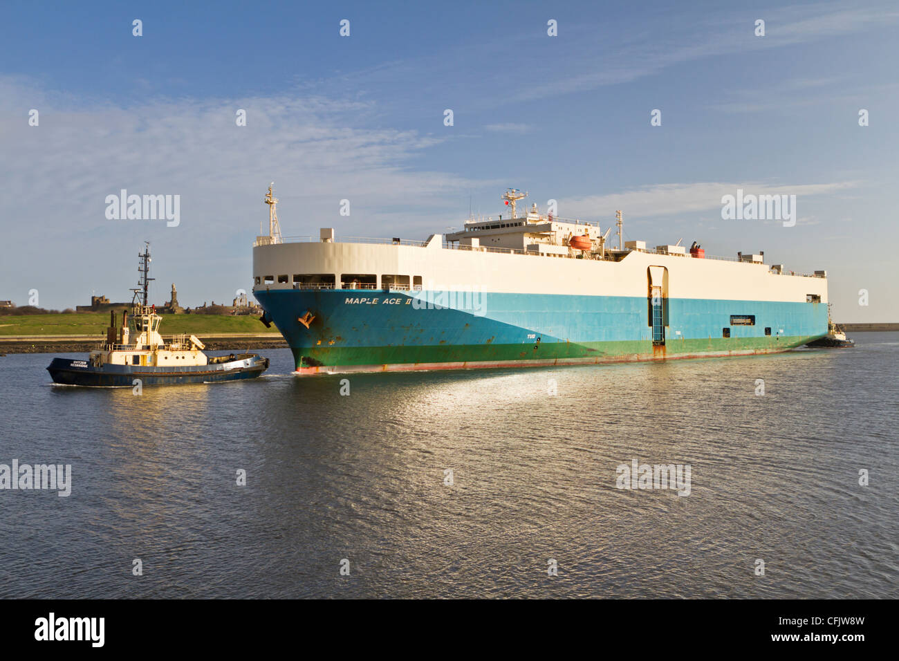 Merchant ship being piloted into the mouth of the River Tyne, South ...
