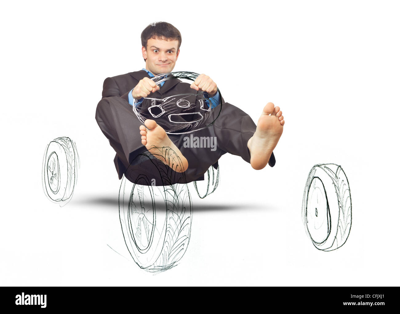 Businessman simulates driving a car. Isolated on white background (with ...