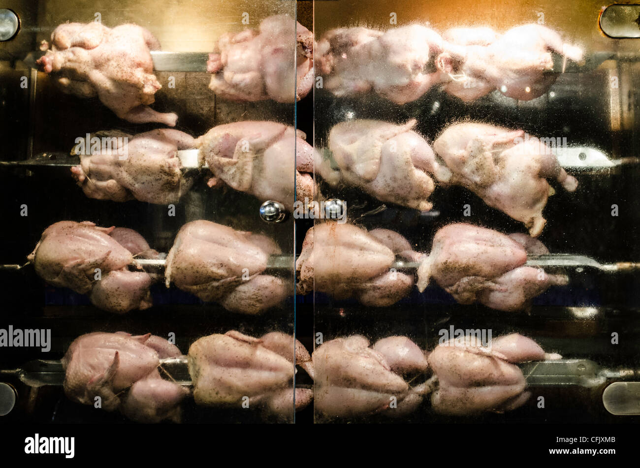 Rotisserie chicken being cooked Stock Photo - Alamy