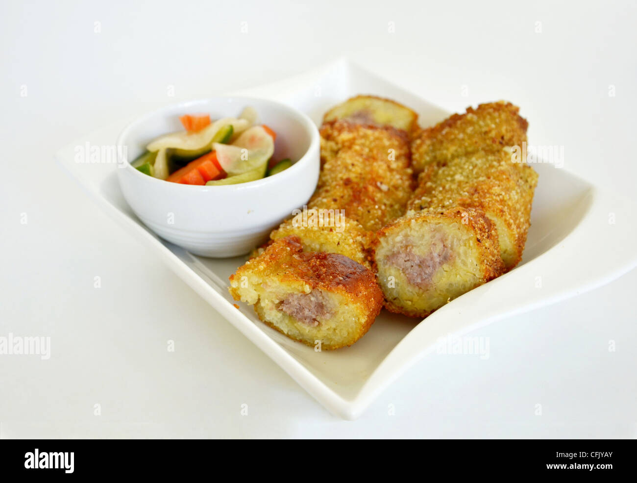 deep fried rice with pork and taro , served with sweet sauce and ...