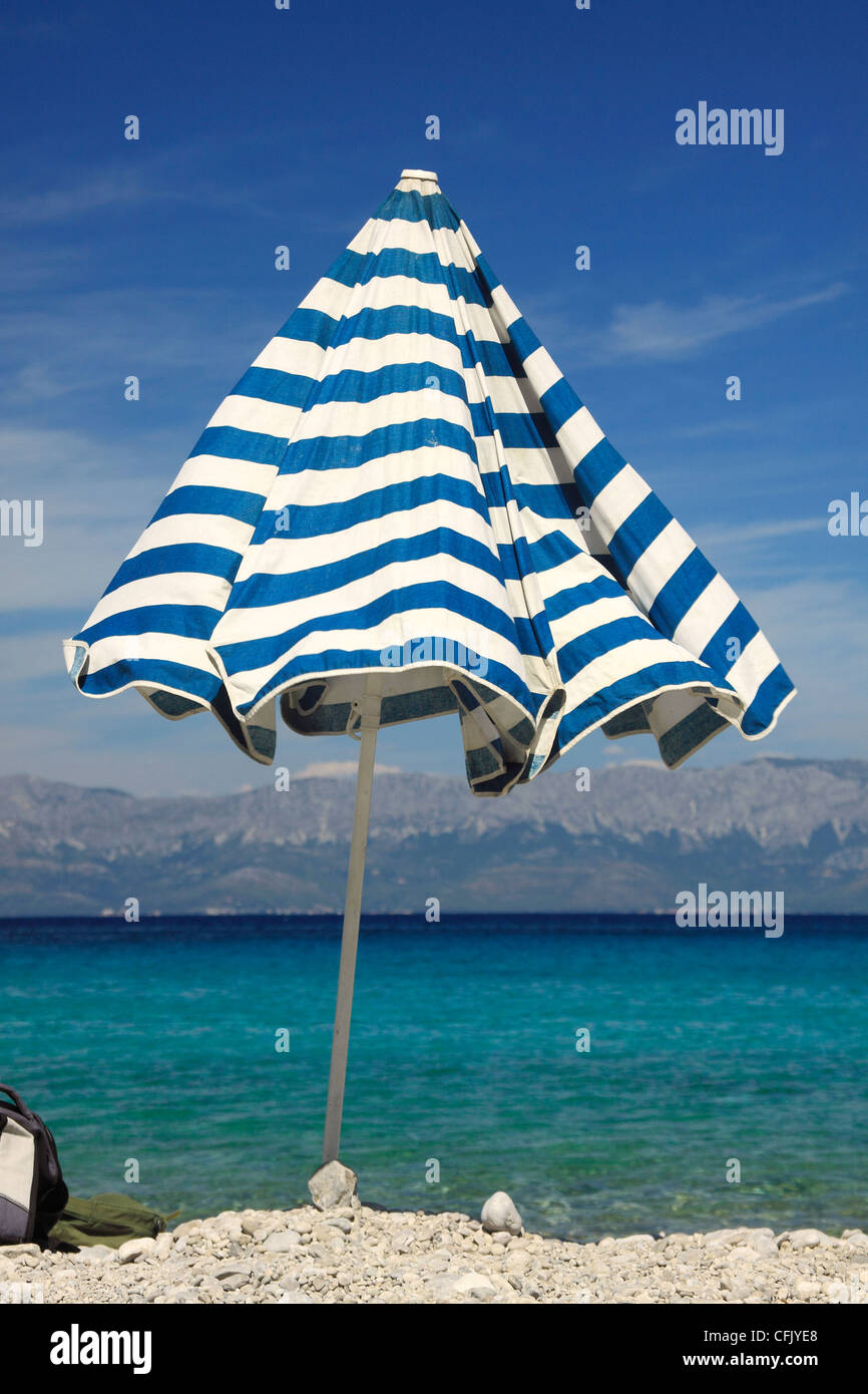 Umbrella on Divna beach, Peljesac peninsula, Croatia Stock Photo - Alamy