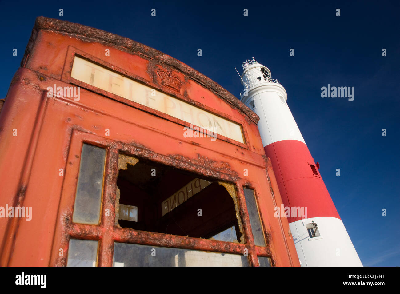 The red and white lighthouse and smashed telephone box at Portland Bill ...