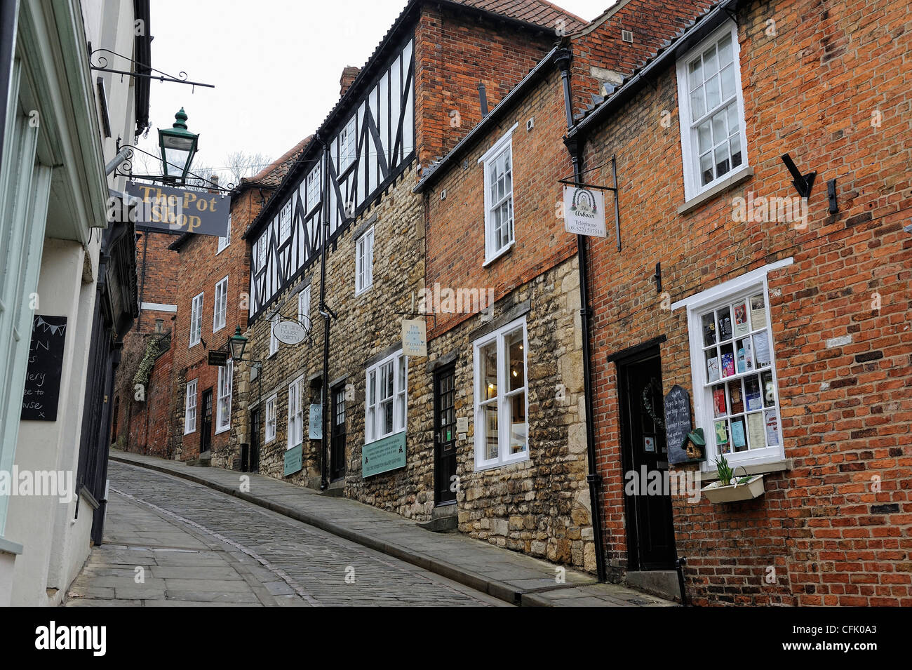 shops on steep hill lincoln england uk Stock Photo - Alamy
