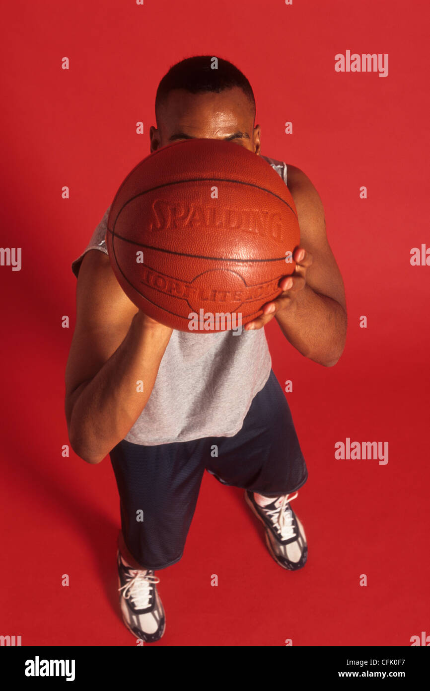 Male basketball player goes up for a shot Stock Photo - Alamy