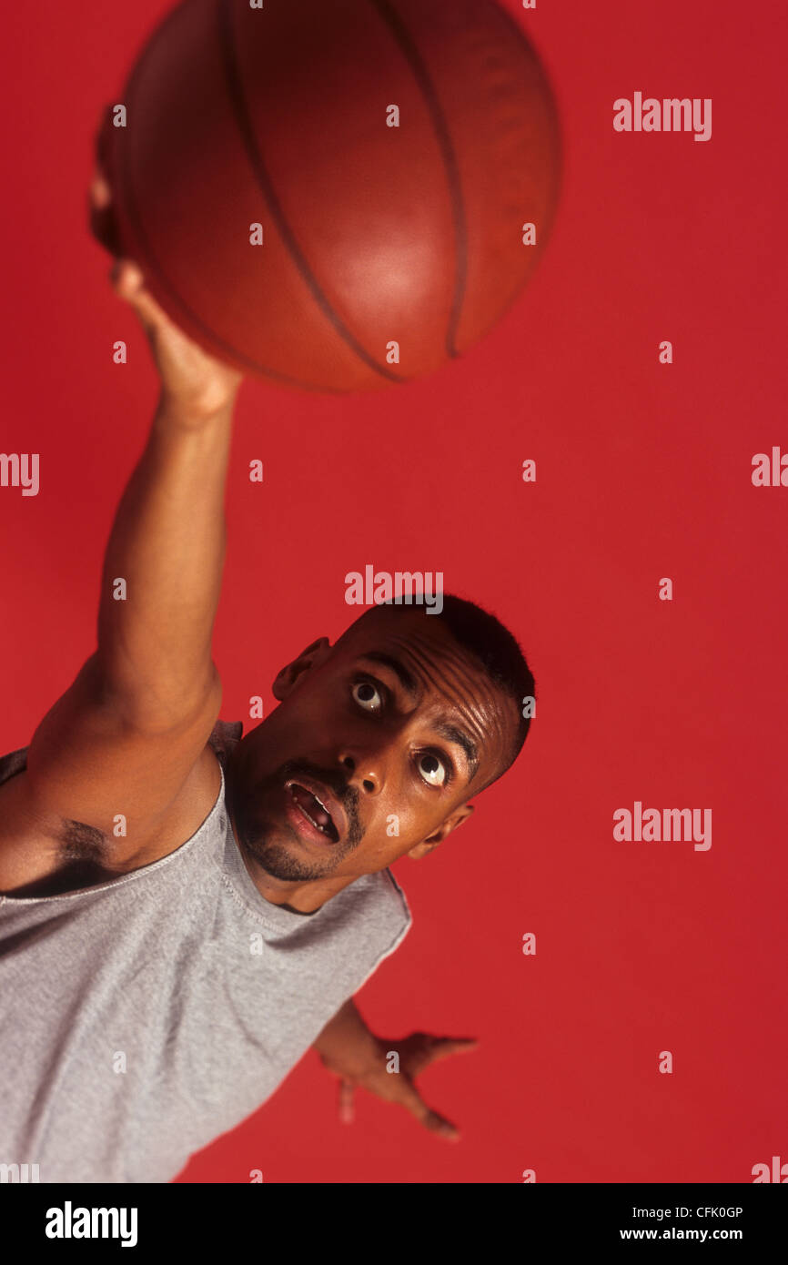 Male basketball player goes up for a shot Stock Photo - Alamy