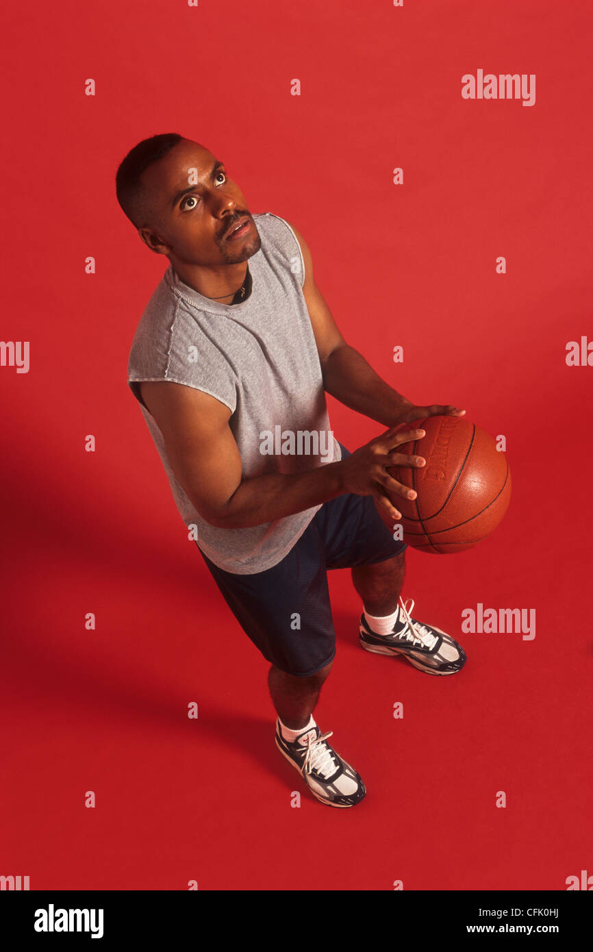 Male basketball player goes up for a shot Stock Photo - Alamy