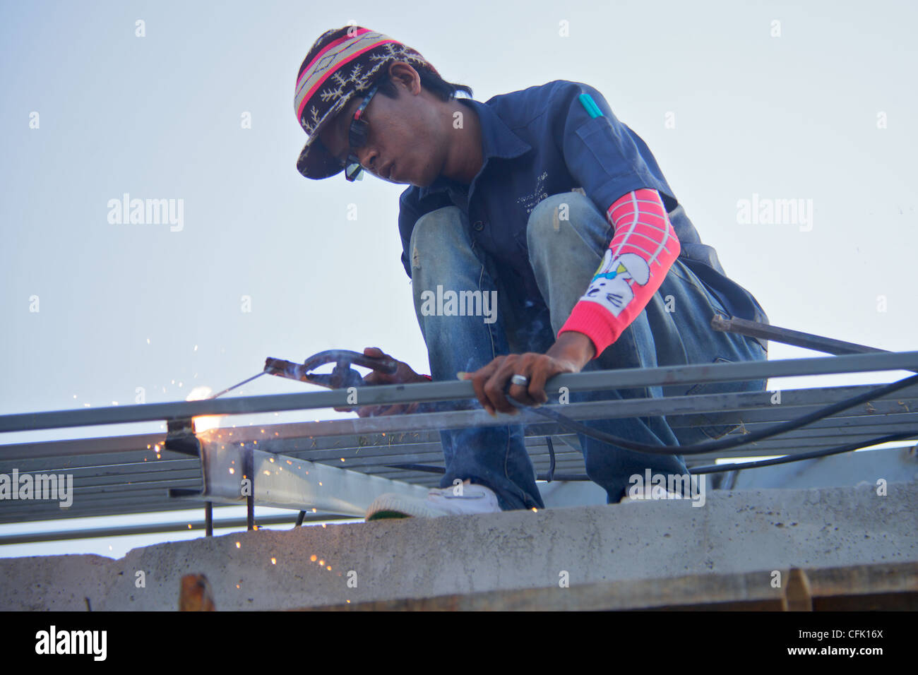 Thai workman arc welding, Phuket, Thailand Stock Photo - Alamy