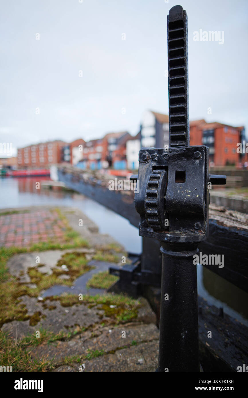 The mechanism of a lock gate with the buildings of Bridgwater quay in ...