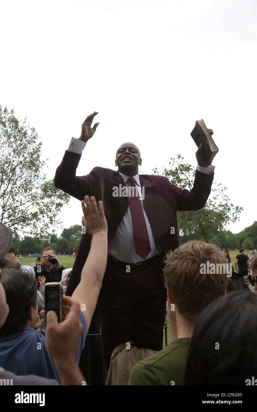 Enthusiastic evangelical preacher, waving his arms around and preaching in Speakers' Corner ...