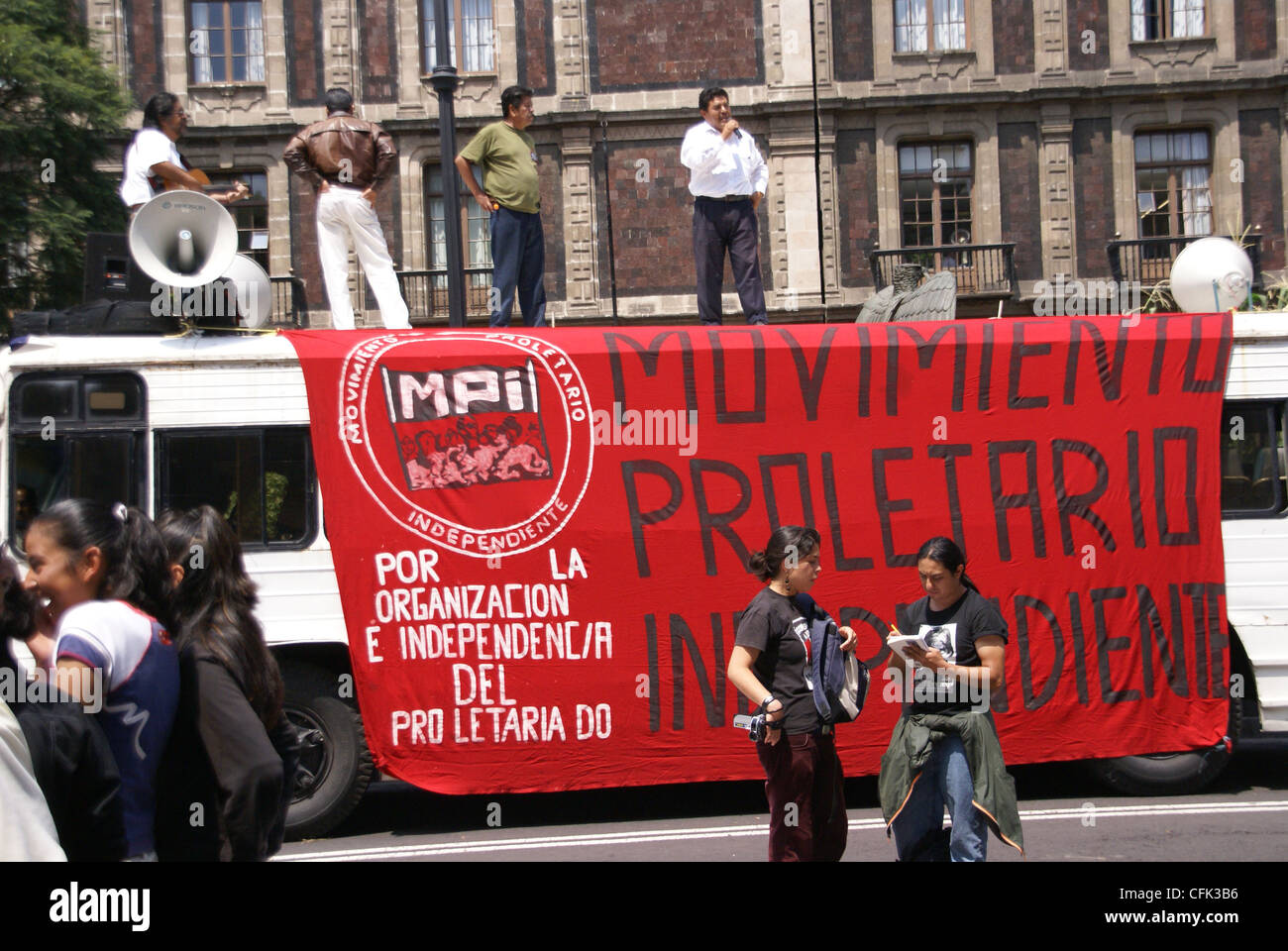 Protesters with red flags at demonstration, Mexico City, Mexico Stock ...