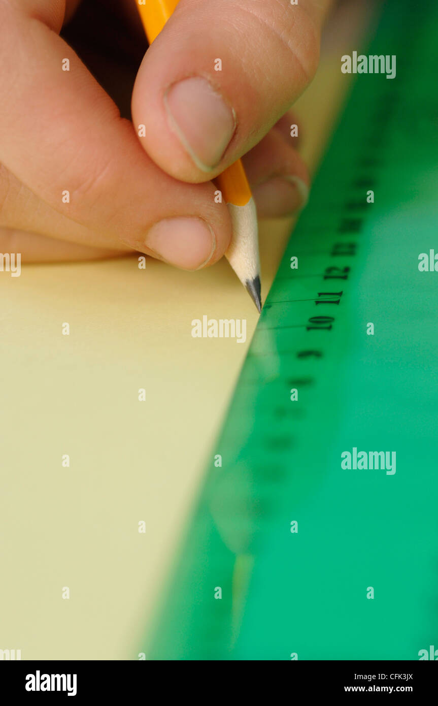 Child using ruler hi-res stock photography and images - Alamy