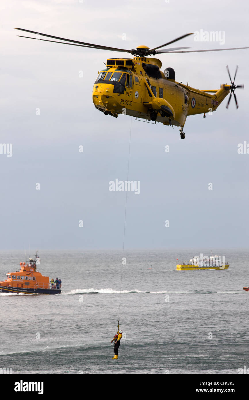 Air-Sea Search and Rescue RAF Sea King helicopter and RNLI lifeboat on ...