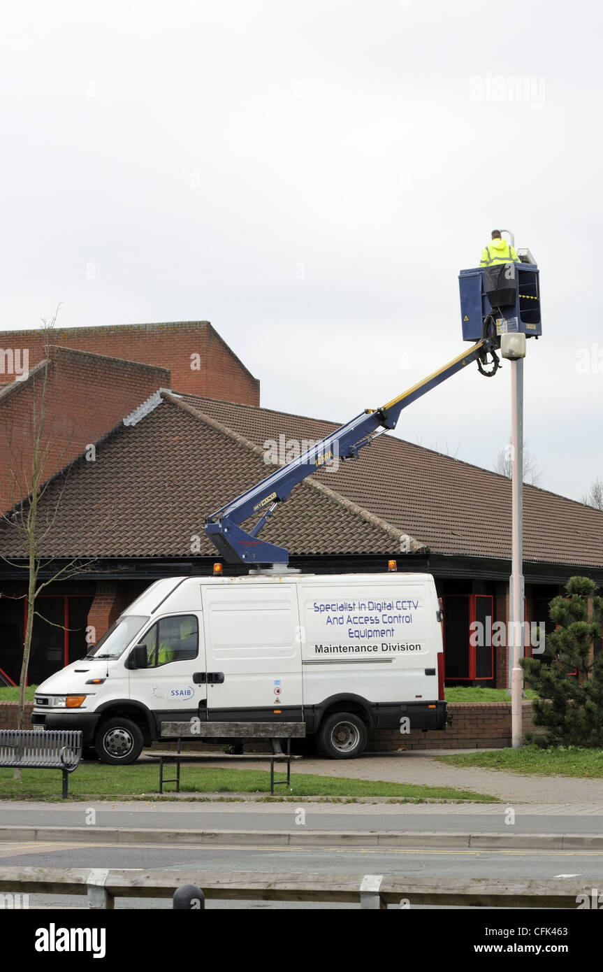 CCTV van with extended hydraulic arm and worker Stock Photo - Alamy
