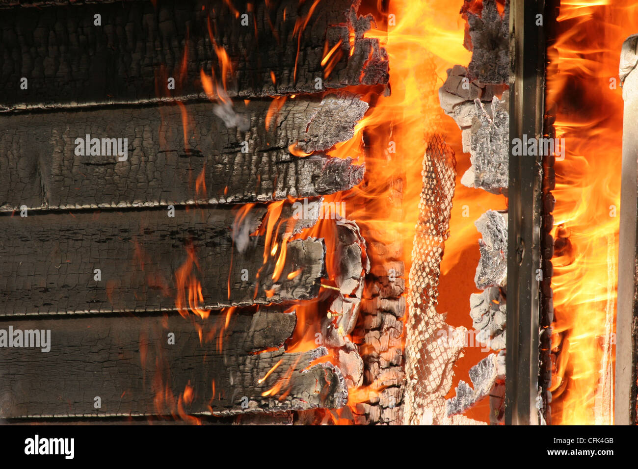 Wood siding and window frame on fire on a residential home Stock Photo ...