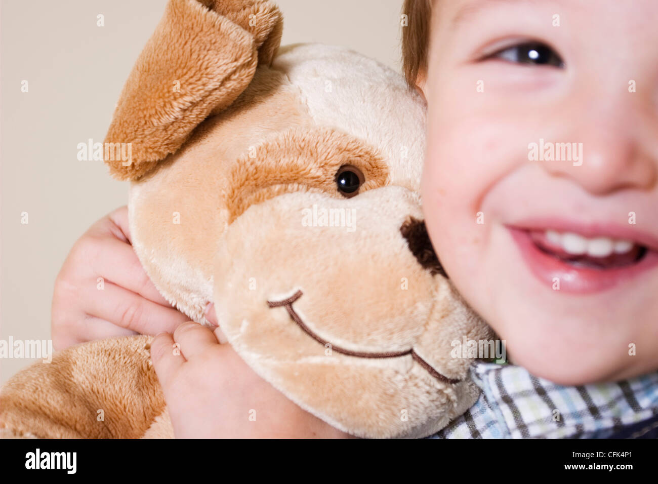 Little Boy Hugging Stuffed Animal Stock Photo - Alamy