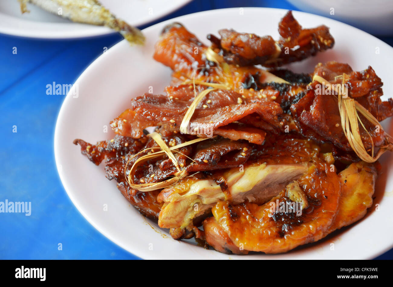 Grilled chicken and beef on a pink dish Stock Photo - Alamy