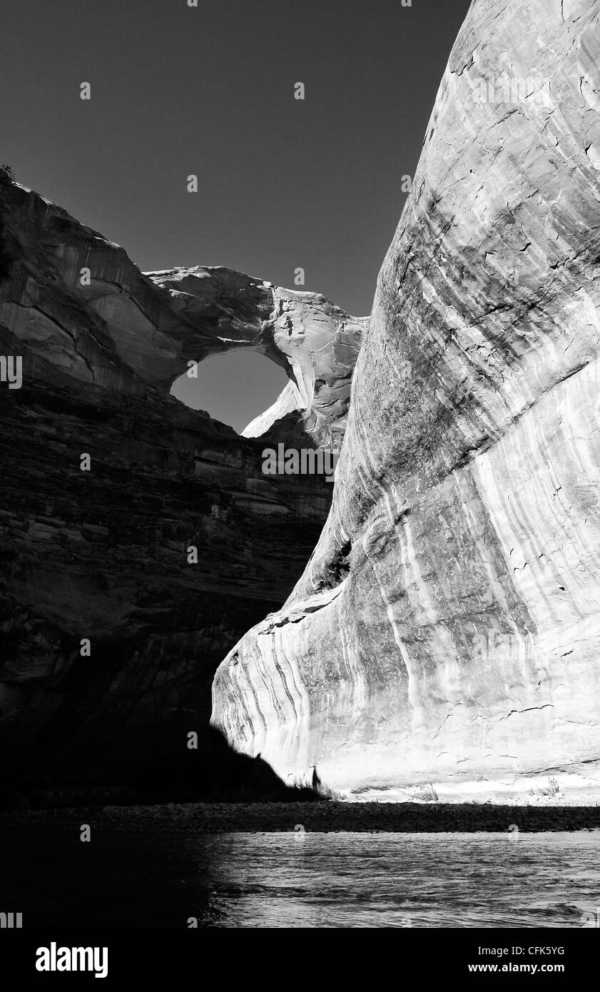 Black & white image of Stevens Arch high on wall above Escalante River ...