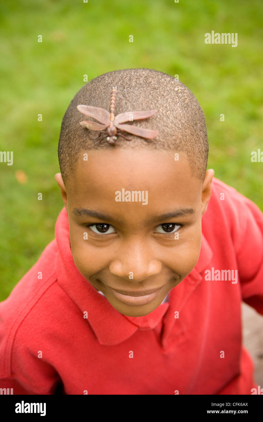 Boy with Insect on his Head Stock Photo - Alamy