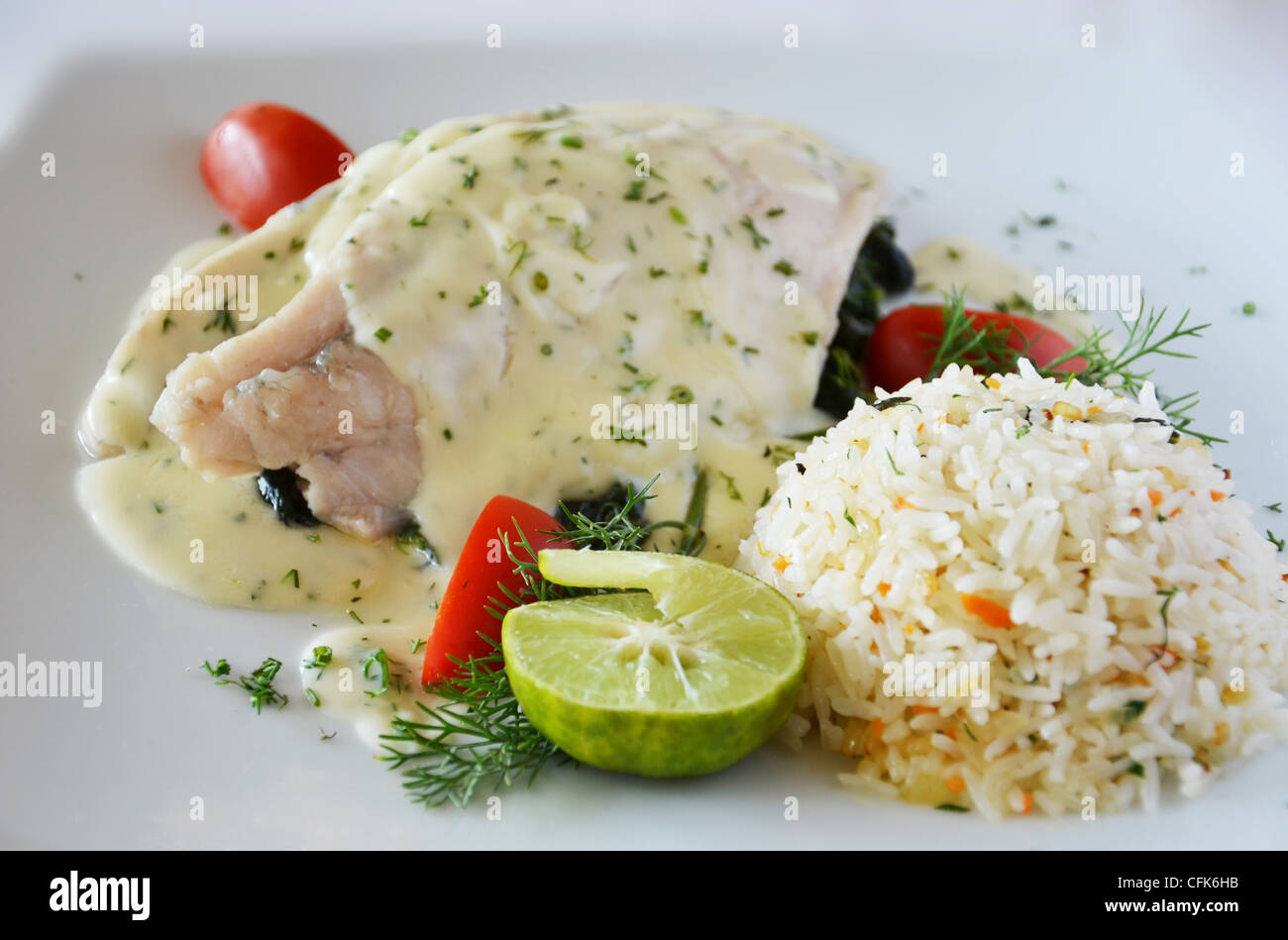 steak from fish with creamy sauce Stock Photo - Alamy