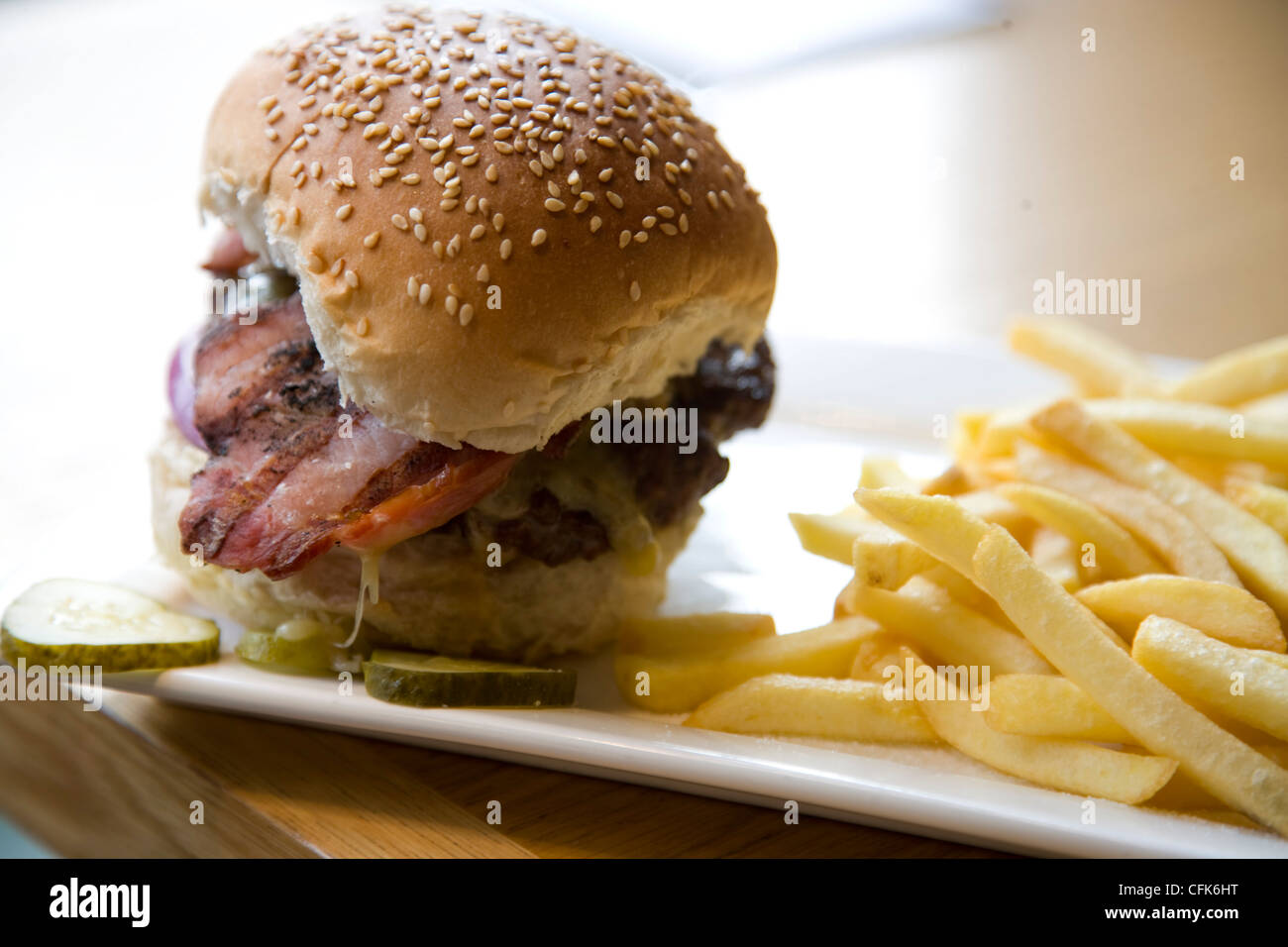 Bacon Beef Burger and Fries Stock Photo - Alamy
