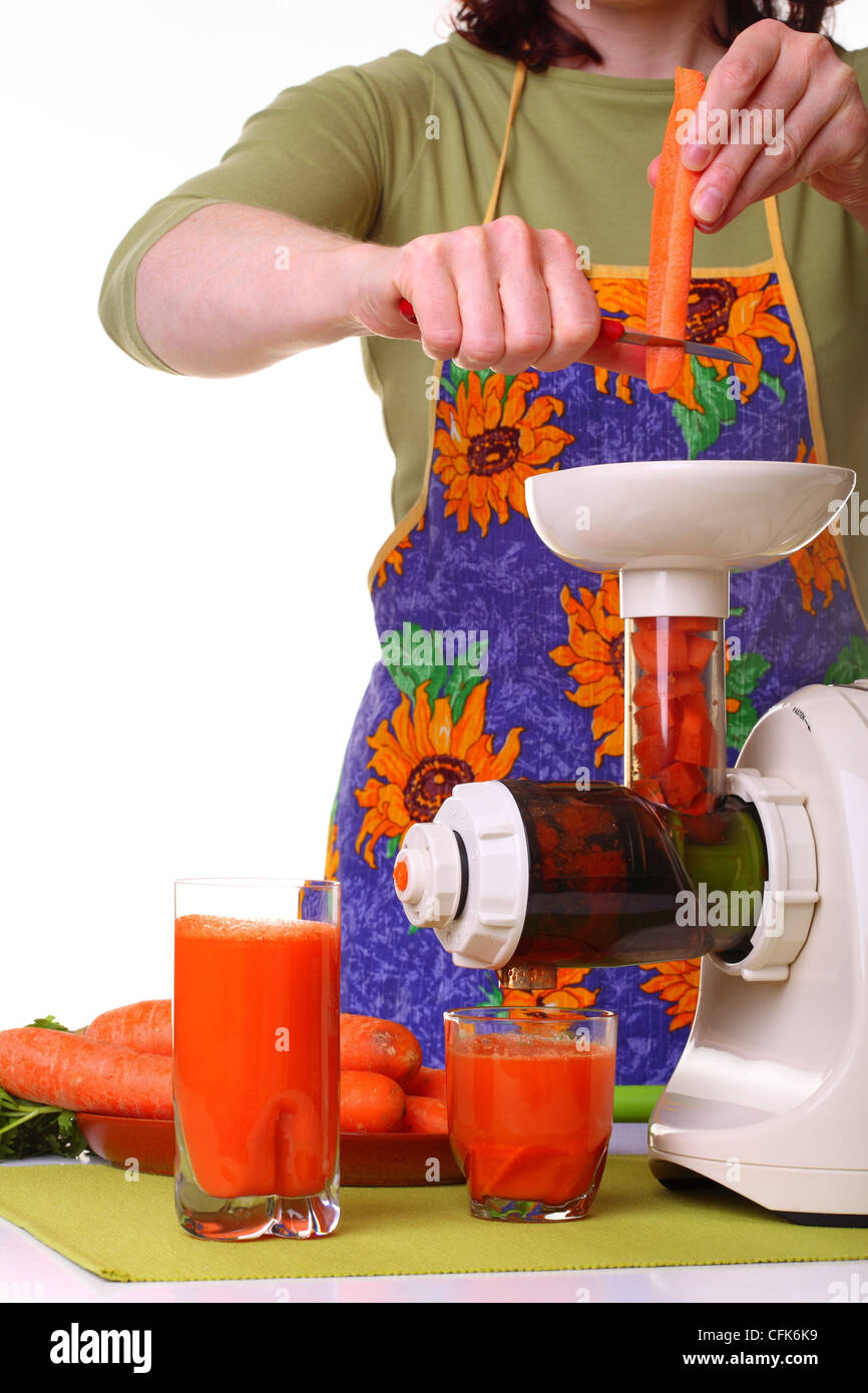 Woman Juice extractor and carrot isolated white kitchen prepare Stock ...