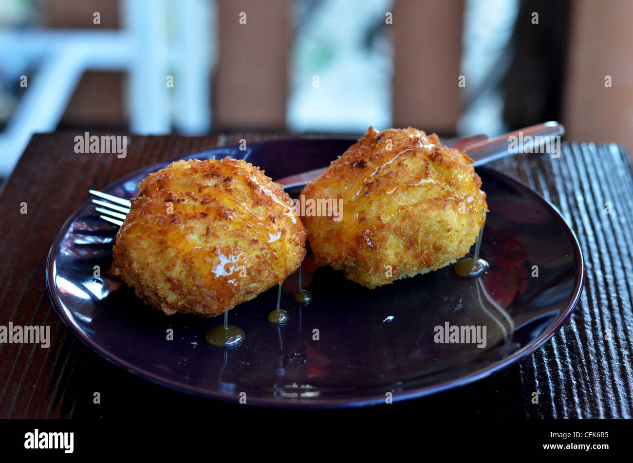 deep fried bread served with honey sauce Stock Photo - Alamy