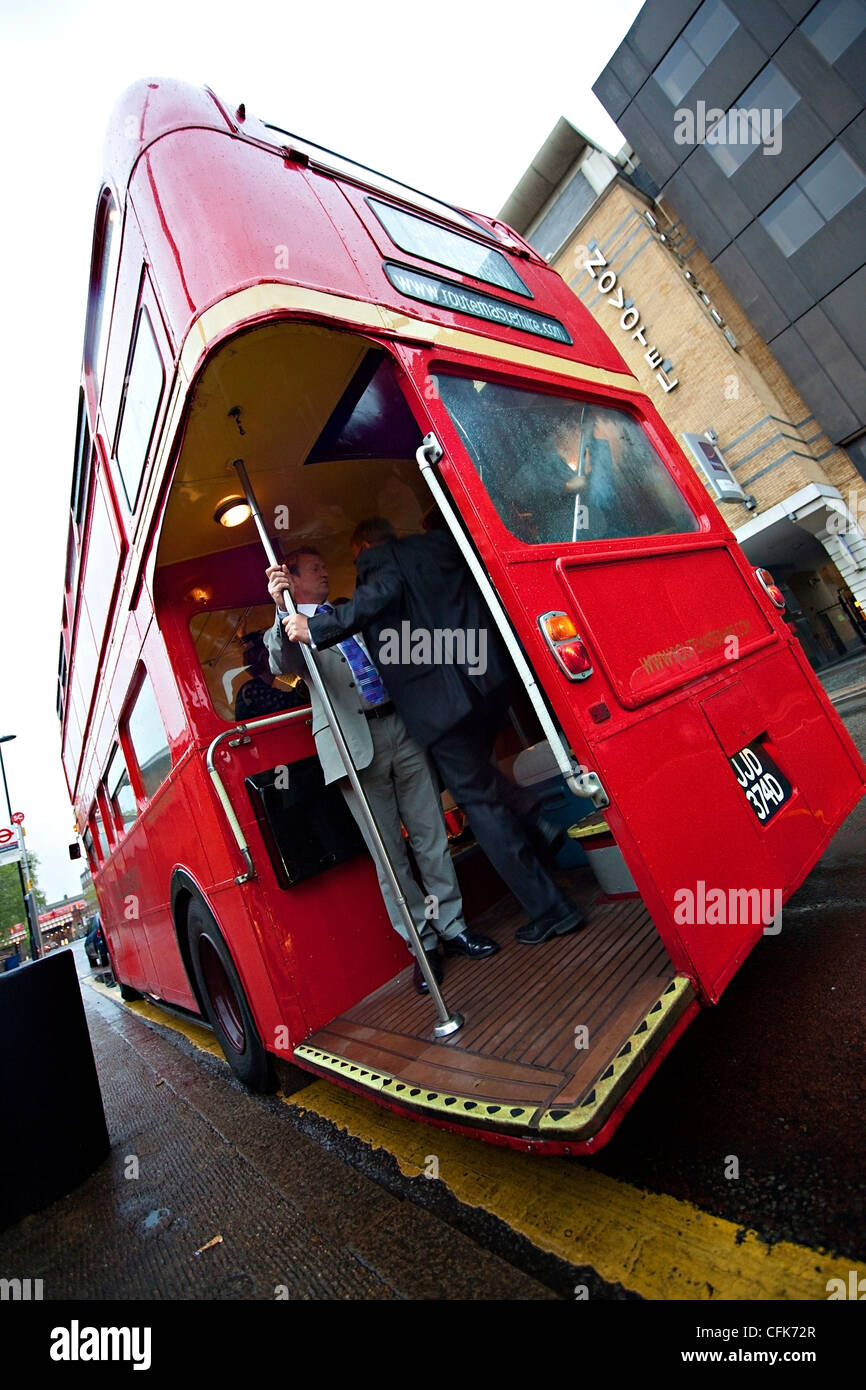 Red old double decker in front of Novotel Stock Photo - Alamy
