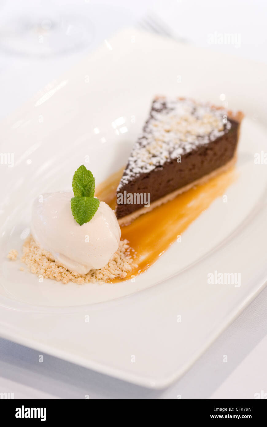 Bitter chocolate tart dessert with ice cream Stock Photo - Alamy