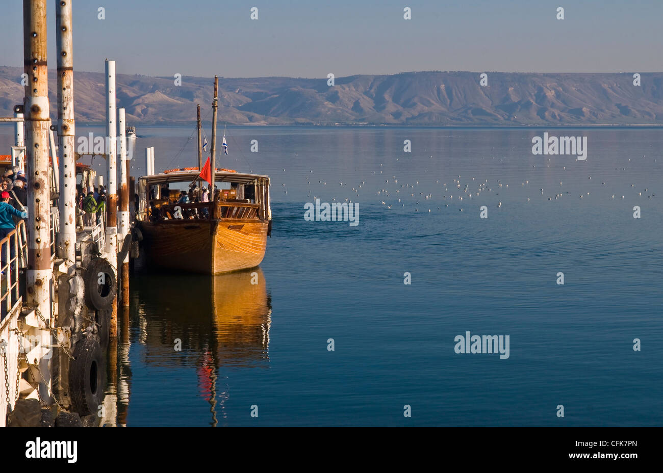 Pilgrims going to sail on the sea of Galilee Stock Photo - Alamy