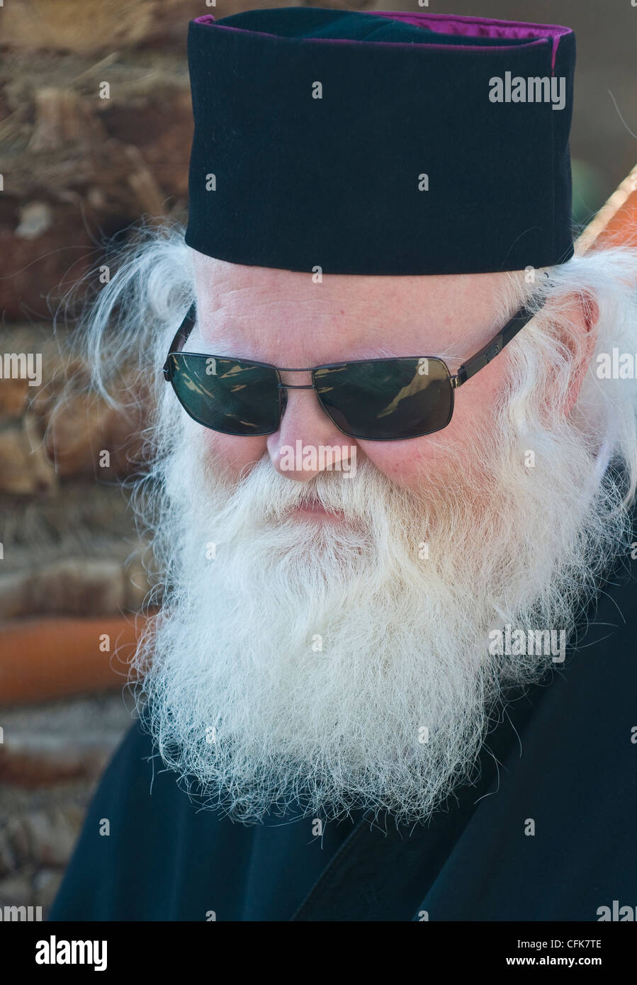 Portrait of Orthodox priest participates in the baptising ritual during ...