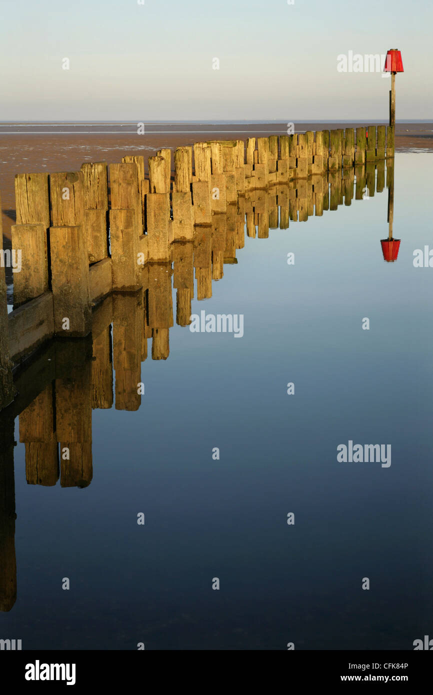Timber sea defence groyne, Cleethorpes beach Stock Photo - Alamy