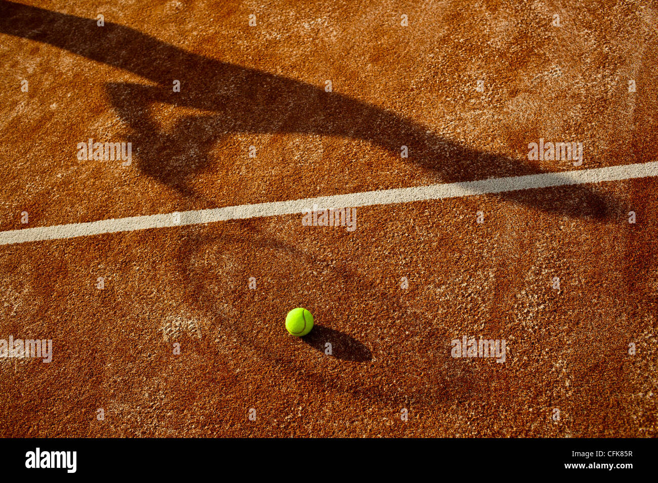 shadow of a tennis player in action on a tennis court Stock Photo - Alamy