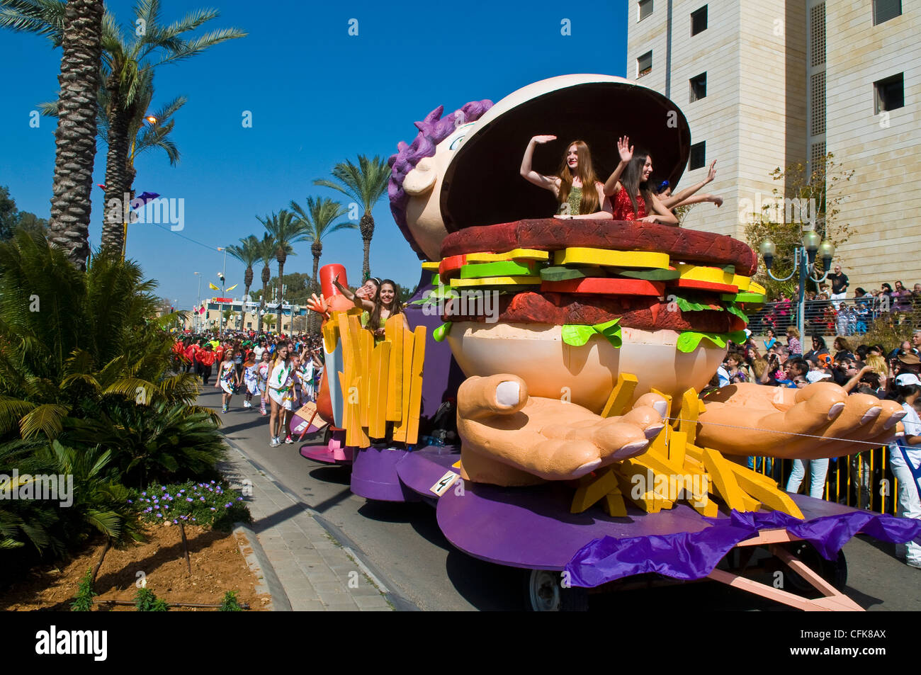 Colorful moving float pass through the street during the Adloyada event ...